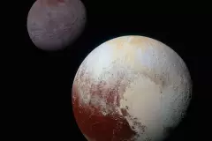 En dynamisk duo Pluto och Charon i förbättrad färg